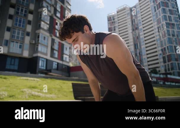 Tired Caucasian European young man sportsman running jogging morning ...