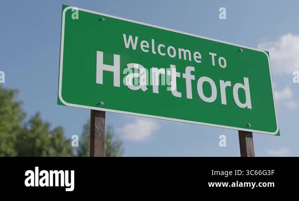 Driving By A Welcome To Hartford, Connecticut Green Road Sign Against a ...