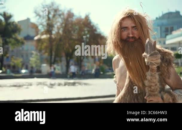 A bearded caveman character engages joyfully with the vibrant urban ...