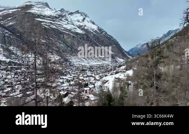 Aerial drone shot of Zermatt city Valley famous travel ski resort and ...