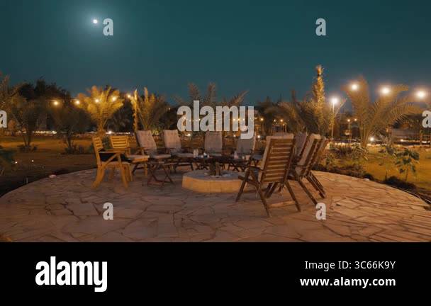 A place to gather around a campfire by moonlight in Saudi Arabia. A ...