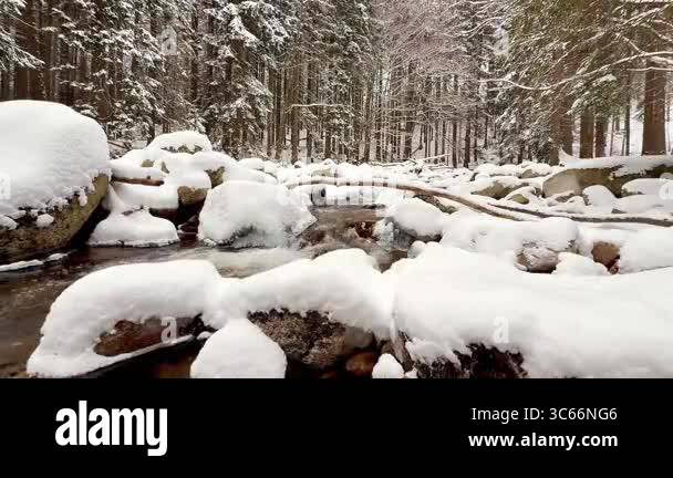 A serene winter scene showcasing a beautiful snowcovered river with ...