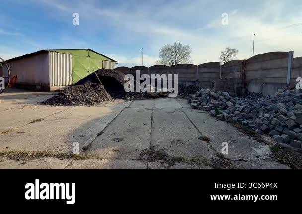 This storage site features large impressive piles of gravel and coal ...