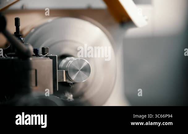 Cutting of metal parts on the lather machine at the factory, industrial ...