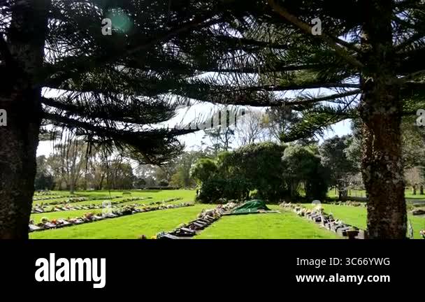 Shot of natural landscape of cemetery graveyard with holy cross and ...