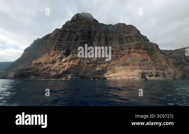 Picturesque nature shot of beautiful sharp sea cliffs and deep blue ...
