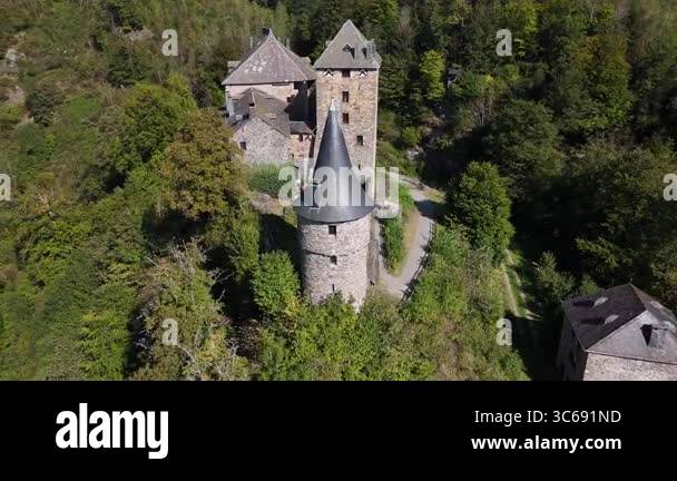 Nestled in a serene setting, the Castle of Reinhardstein captivates ...