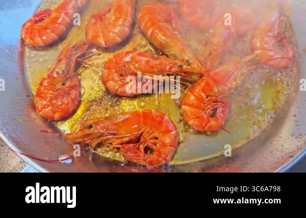 Culinary recipe with fresh fired shrimps seafood prepared in Valencia ...
