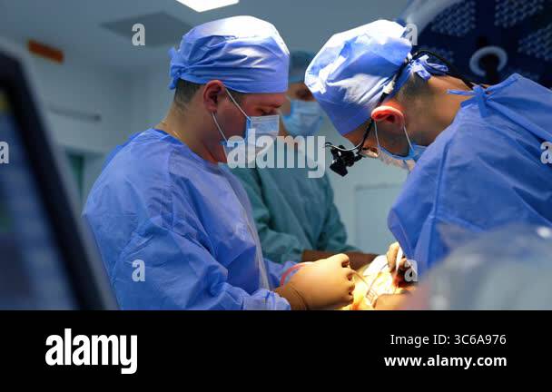 Male surgeons are cutting patient's skin starting a surgery. Doctors ...