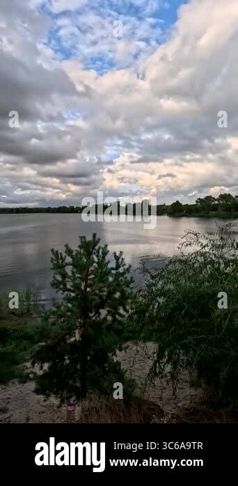 beautiful natural landscape with clouds. clouds over water. reflection in water. on the lake ...