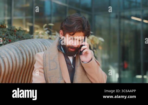 Indian young businessman tourist having bad stressful news calling on ...