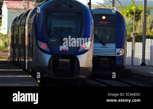 Nice, France - January 24, 2025: Close up of two trains moving on the ...