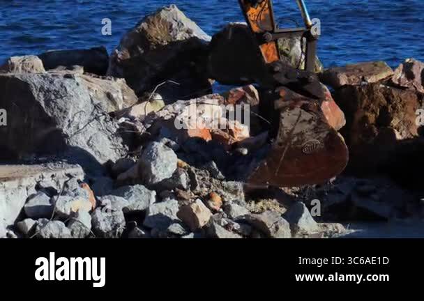 Excavator picking up rocks Stock Videos & Footage - HD and 4K Video ...