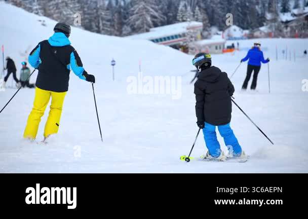 Dolomites, Italy - January 15, 2025: Multiple people skiing on the ...