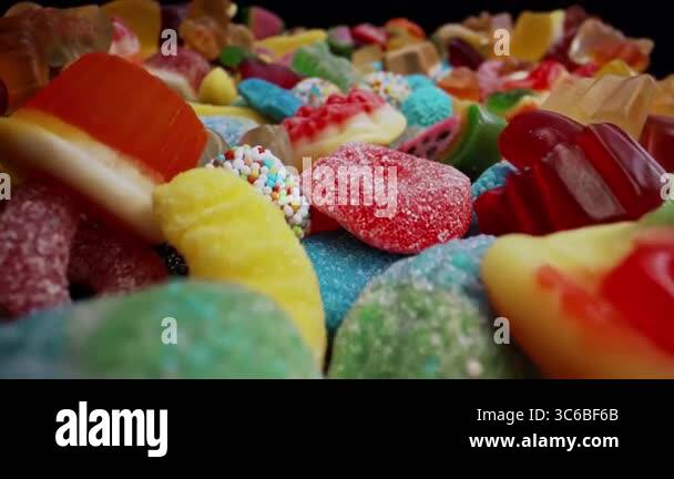 Extreme macro slider view of jelly gummy bears texture background ...