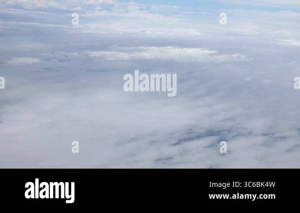blue sky with white fluffy clouds from airplane flight fly over the ...