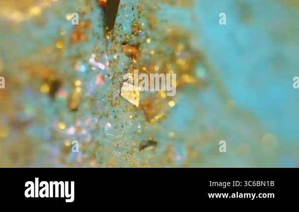 Vertical video. Glitter paint mix. Shimmering liquid texture. Blur blue ...