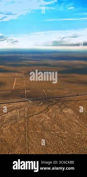 Endless scenery of desert in Nevada. Beautiful clouds throwing shadows ...
