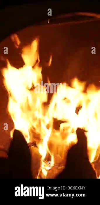 Vertical. Intricate, ornate old fireplace, flames dancing through ...