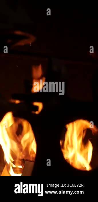 Vertical. Intricate, ornate old fireplace, flames dancing through ...