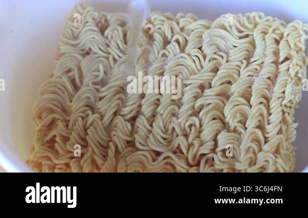 Noodle. Pouring boiling water into a noodle. Hot soup Stock Video ...