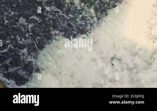 Strong current of river water. Flow of water over stones in a river ...