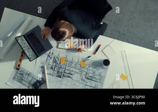 Top view of civil engineer using ruler and equipment to measure ...