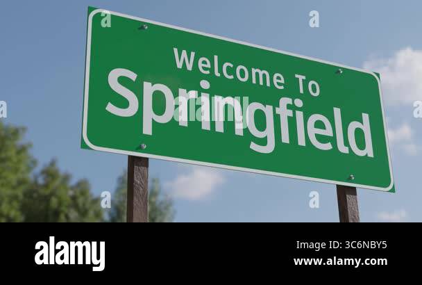 Driving By A Welcome To Springfield, Illinois Green Road Sign Against a ...
