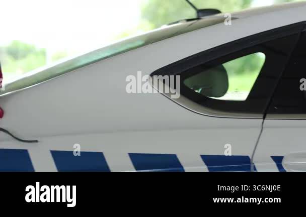 Sad young woman arrested by police officers and handcuffed sitting in ...