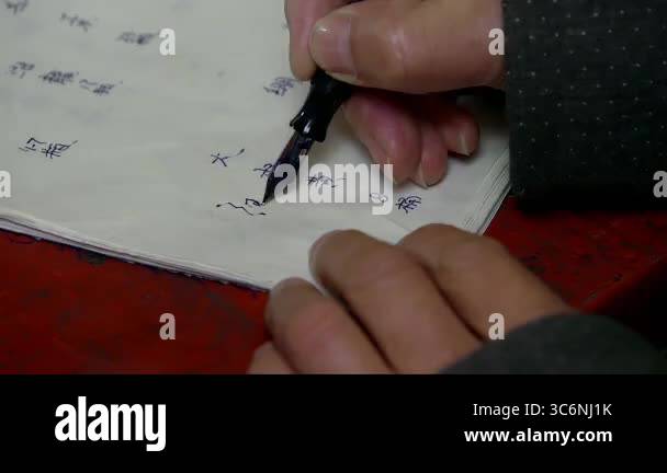 Signing with fountain pen, Chinese character for "Da Tong Huang", close ...