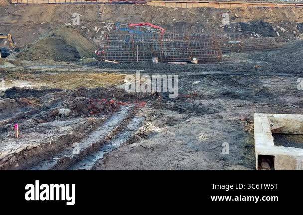 An active construction site that showcases various ongoing activities such as excavation ...