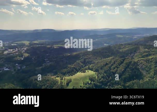 A stunning aerial perspective of verdant mountains and rolling hills ...