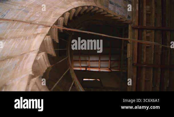Stairs in an old abandoned house. Broken ceilings and collapsed wood ...