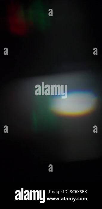 Light leaks and glass prism refractions in slow motion. Vertical Format ...
