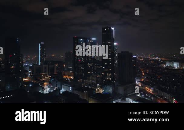 Night cityscape with illuminated skyscrapers and distant lights ...