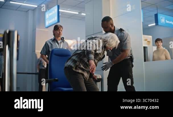 Security Checkpoint: Diverse TSA Officers Checking Elderly Man in ...