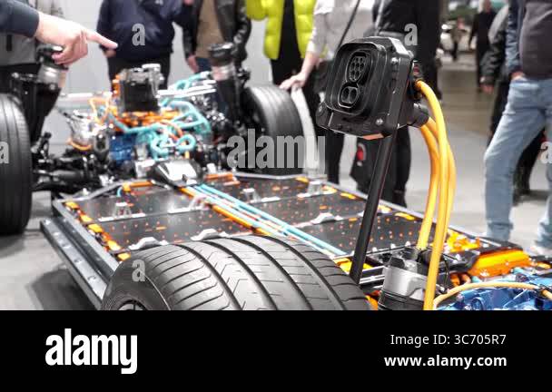 Helsinki, Finland - March 15, 2025: A group of people closely examining ...