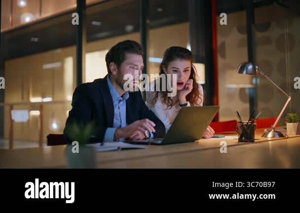 Nervous coworkers closing laptop frustrated project failure at dark ...