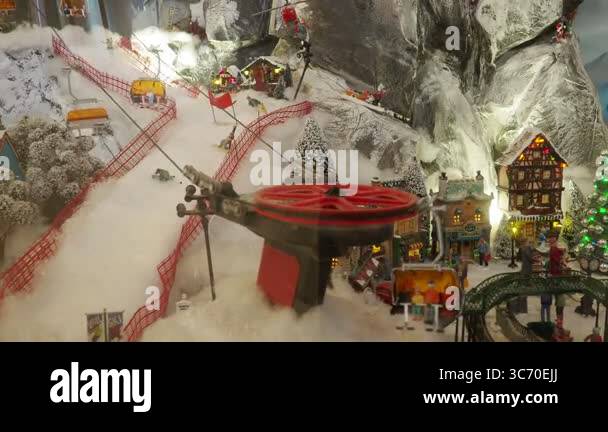 Captivating display features a miniature ski resort with vibrant houses ...