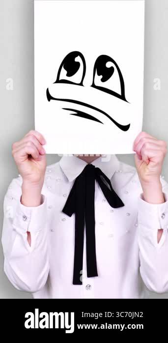 portrait, teenager holds white paper sheet with disappointed smiley ...