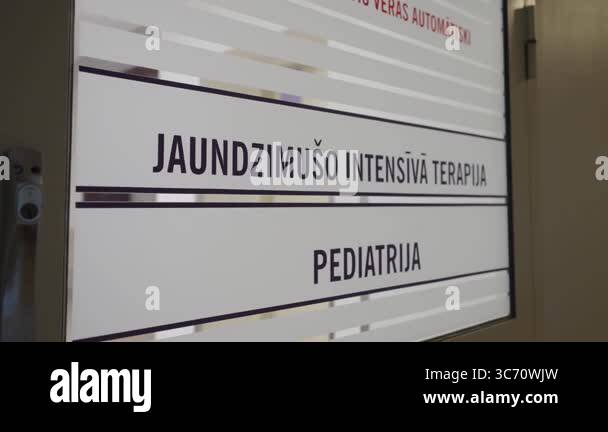 Valmiera, Latvia - March 24, 2025 - Close-up of a hospital door sign in ...