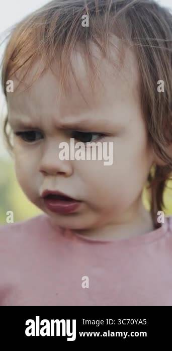 Vertical screen: An Emotional Toddler Expressing Deep Confusion While ...