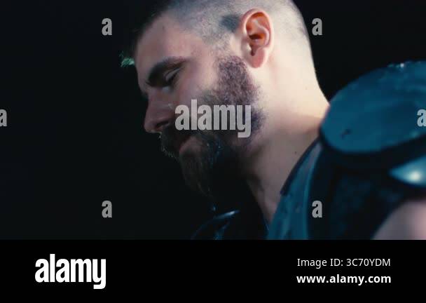 Close-up portrait of an American football player sweating after an ...