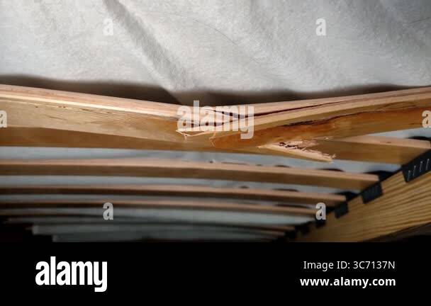 Broken wooden slat on bed under mattress on sleeping place Stock Video ...
