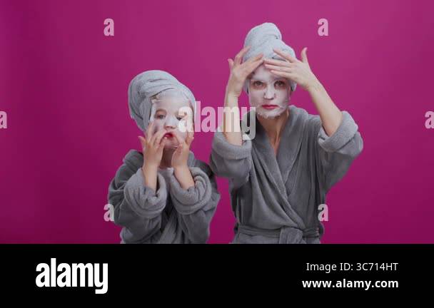 Beautiful family of happy mother and daughter doing bath routine ...