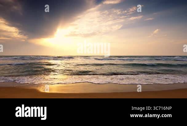 Beautiful sunrise over the sea waves and beach sand, tropical ocean ...