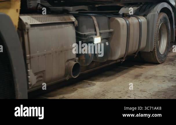 No people pan shot of low part of car truck in auto repair shop Stock ...