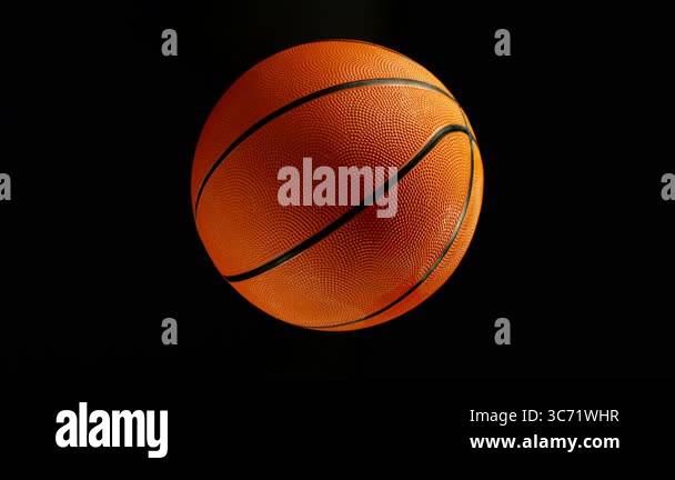 Super Slow Motion of Moving Basketball Ball. Isolated on Black ...