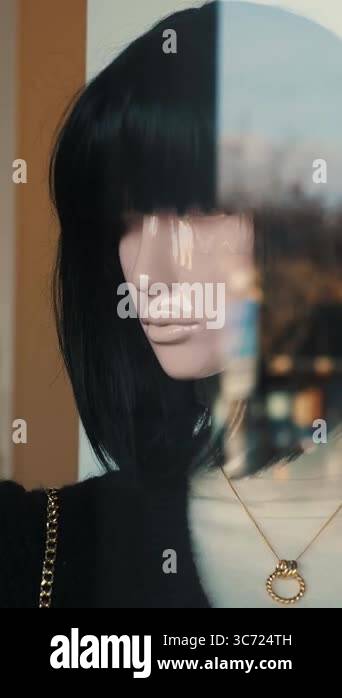 The hairdresser washes the woman's hair before coloring. The stylist is ...