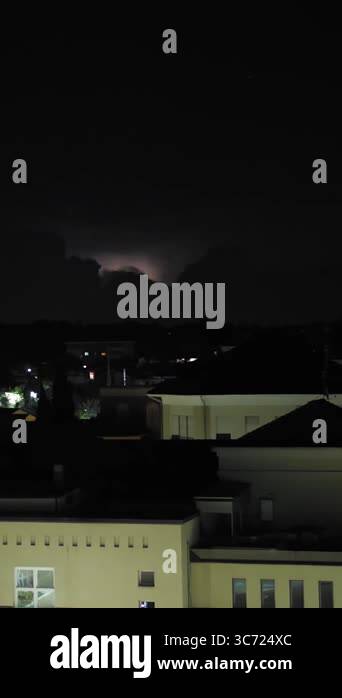 Flashes of lightning over the city at night during a powerful ...